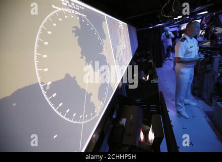 The Combat Information Center (CIC) is seen inside the U.S. guided ...