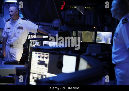 The Combat Information Center (CIC) is seen inside the U.S. guided ...