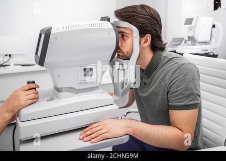 Ophthalmologist is checking up patient in eye doctor hospital Stock ...
