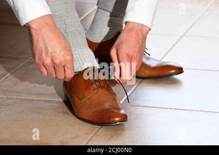 Bride and groom are getting ready in the morning for the wedding ...