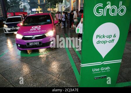 'Grab' pick up and drop off point sign- a Singapore based a ride ...