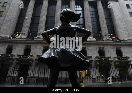 The bronze statue, "The Fearless Girl" by the artist Kristen Visbal ...