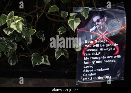 Tributes to George Michael outside his house in Highgate, north London ...