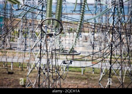 A photo of an electrical power substation transformer with cooling fans ...