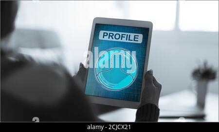 Tablet screen displaying a profile concept Stock Photo - Alamy