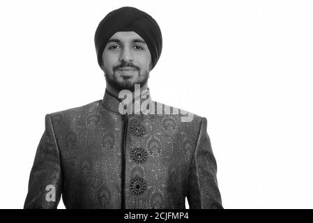 Portrait of an elegant Sikh man with black turban, beard and mustache ...