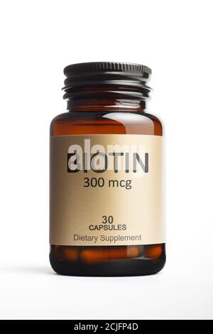 Vitamin B7, biotin supplement. White pills forming shape to B7 sign on ...