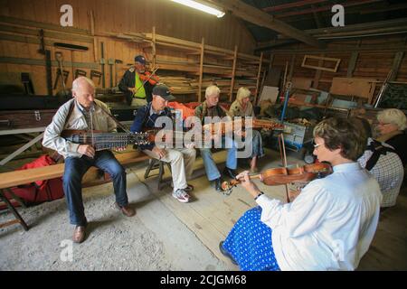 KEYED FIDDLE indoor playing their Keyed fiddle with musician friends ...