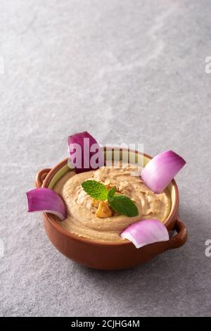 Gofio escaldado in bowl on wooden table.Typical canarian food Stock ...