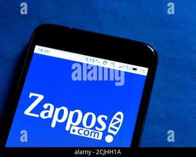 In this photo illustration a Zappos logo seen displayed on a smartphone ...
