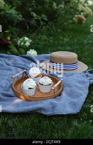 cupcakes with butter cream on a picnic Stock Photo - Alamy