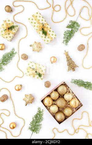 Christmas decorations in gold colors on white background. Gift, holiday ...