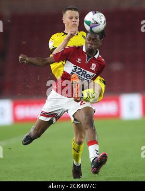 Middlesbrough's Sam Folarin in action dwith Barnsley's Marcel Ritzmaier ...