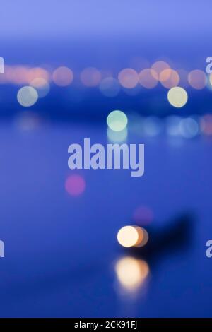 Defocus cityscape at twilight, bright and colourful blurred background ...