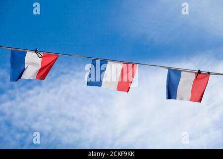 French flag bunting for Bastille day before the war memorial of the ...