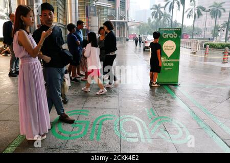 'Grab' pick up and drop off point sign- a Singapore based a ride ...