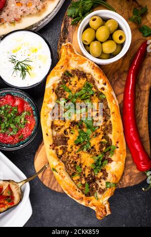 Traditional Turkish baked pide dish. Middle Eastern snacks Stock Photo ...