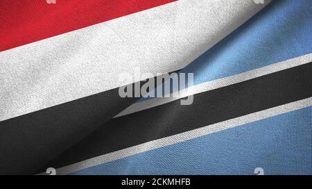 Botswana and Yemen two flags textile cloth, fabric texture Stock Photo ...