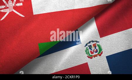 Dominican Republic and Oman two flags textile cloth, fabric texture ...
