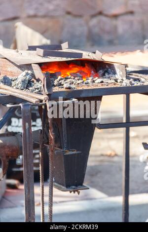 Burning coal in iron brazier. Preparation for barbecue. Fireplace with ...