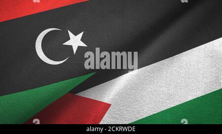 Palestine and Libya two flags textile cloth, fabric texture Stock Photo ...