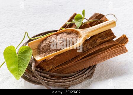 bark and powder of licorice medicinal plant, on white background ...