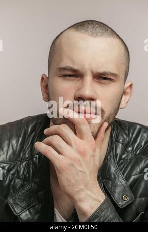 distrustful sceptic young man portrait career Stock Photo - Alamy