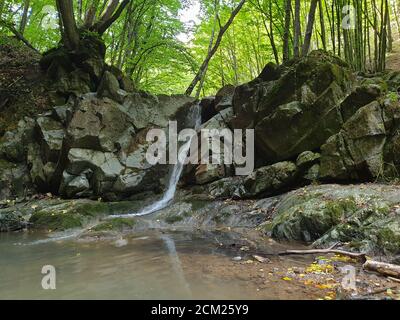 A small waterfall in a rocky area Stock Photo - Alamy