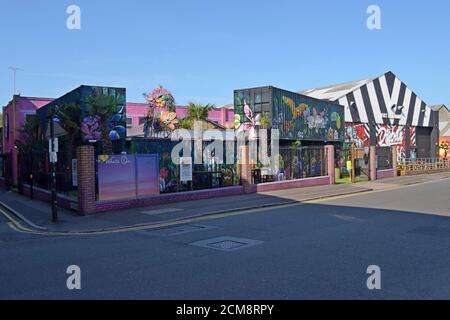 Recycled shipping containers decorated with vivid street art murals ...