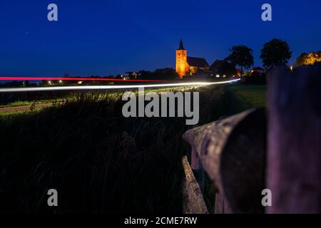 Medieval church in the floodplains on a dike of a Dutch river landscape ...