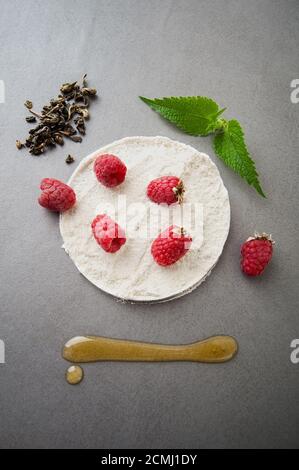 Raspberry berries and fresh mint leaves on dark background Stock Photo ...