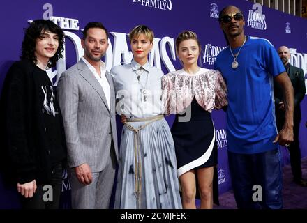 (L-R) THE ADDAMS FAMILY Cast - Finn Wolfhard, Nick Kroll, Charlize ...
