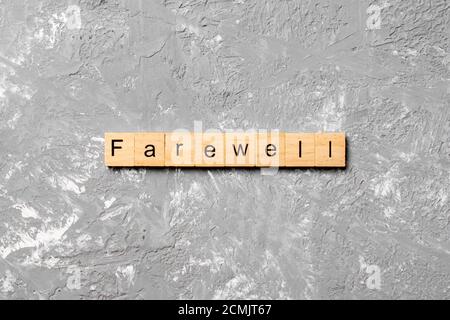 farewell word written on wood block. farewell text on table, concept ...