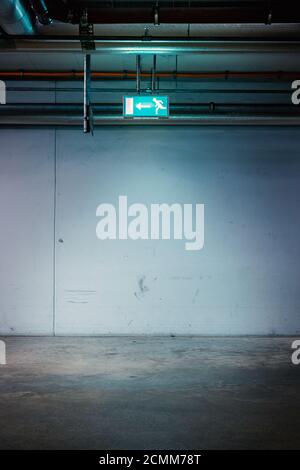 exit sign under the ceiling Stock Photo - Alamy