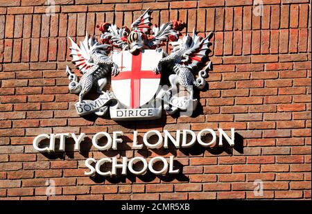 Name and crest of the City of London School fixed to brick wall of ...
