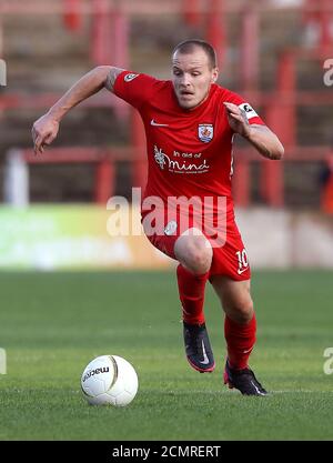Connah's Quay Nomads' Jamie Insall (left) is helped off the pitch with ...
