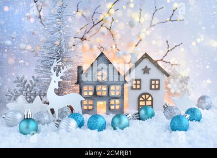 Christmas composition with decorative deer, huts and festive ...