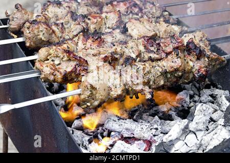 The pieces of meat roasted on a spit over charcoal Stock Photo - Alamy