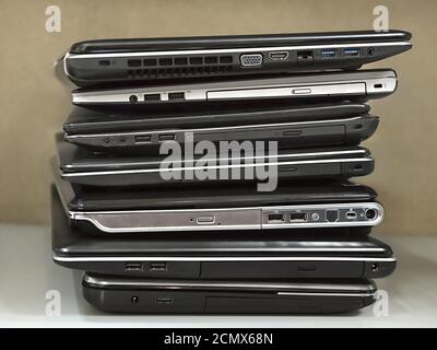 Stack of laptops Stock Photo - Alamy
