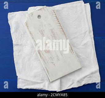 Clean cutting board and towel on blue background Stock Photo - Alamy