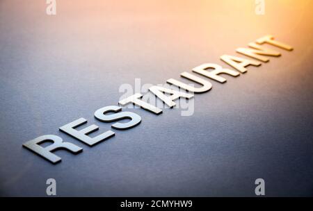Word restaurant written with white solid letters on a board Stock Photo ...
