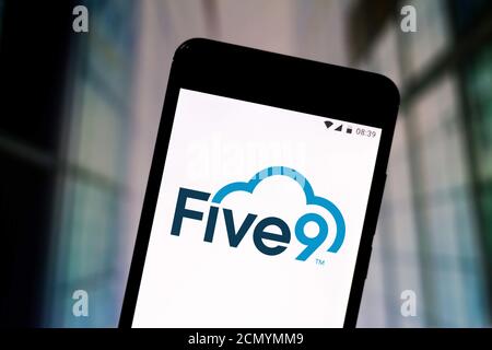 In this photo illustration, the Five9 logo is seen displayed on a ...