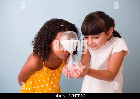 Two Kids Watching the Timer Stock Photo - Alamy