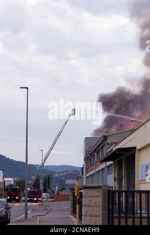 Firefighters, police, toilets, ambulances in a factory fire. Fire ...
