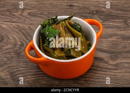 Vagan cuisine with roasted green bean and cabbage Stock Photo - Alamy