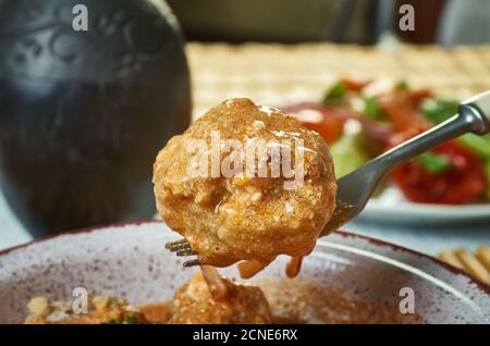 Sciusceddu - soup in Italian cuisine prepared using meatballs and ...