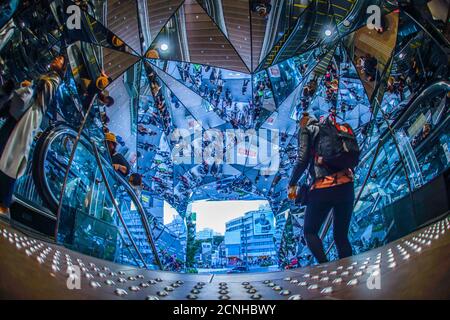 Tokyu Plaza Omotesando Harajuku mirror entranceway reflects a ...