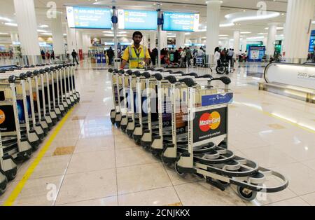 Luggage Trolleys, Dubai International Airport UAE Stock Photo - Alamy