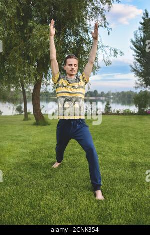 man doing sports and stretching leg outdoors Stock Photo - Alamy