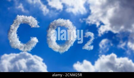 CO2 emissions pollution. Carbon Dioxide cloud text sign on black color ...